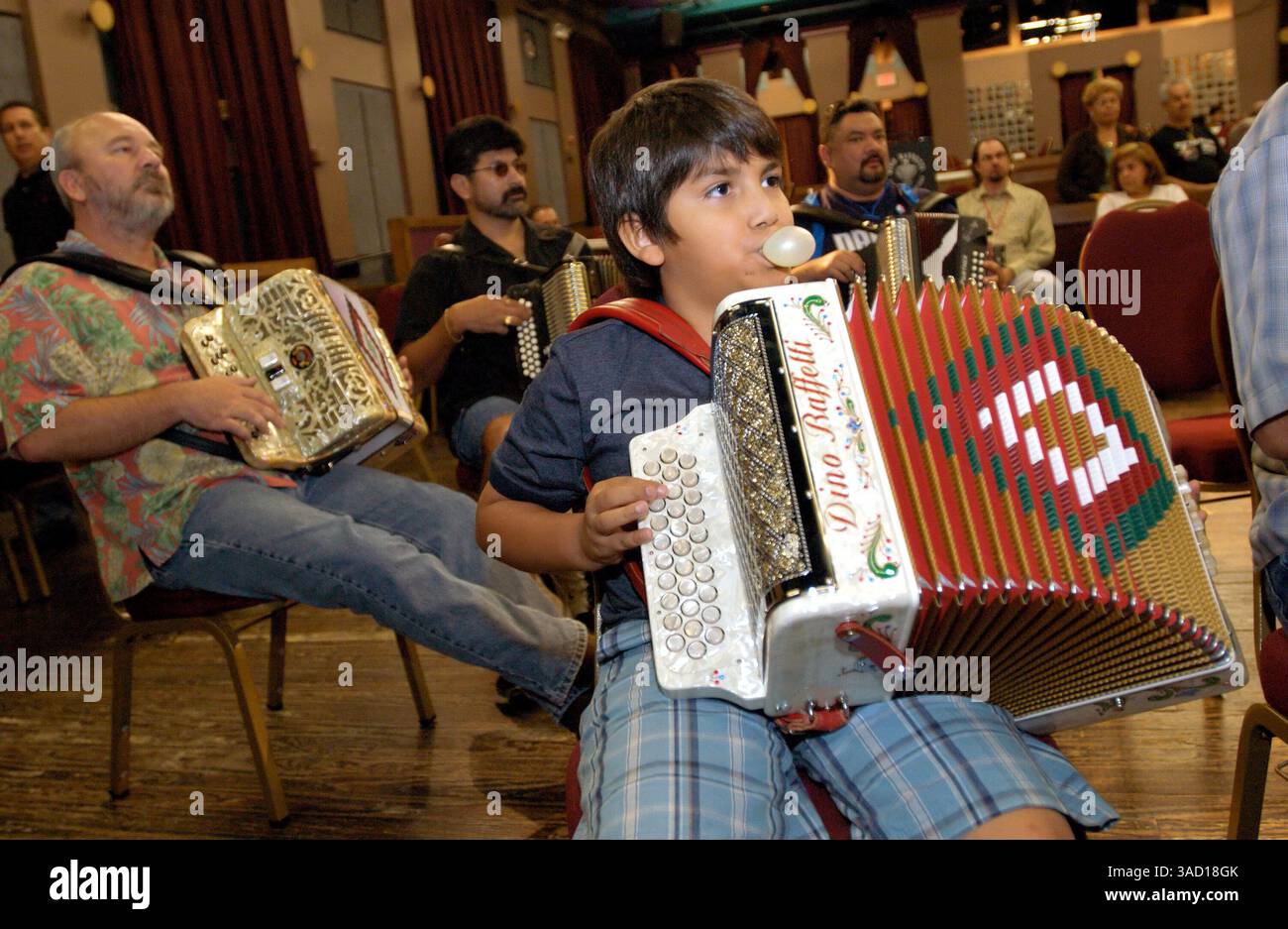 May 11, 2006 - San Antonio, Texas, USA - Joel Gabriel Guzman blows a bubble during the accordian ...