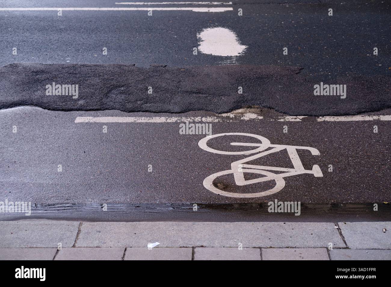 Potholes and damage to a road in the city were repaired very ...