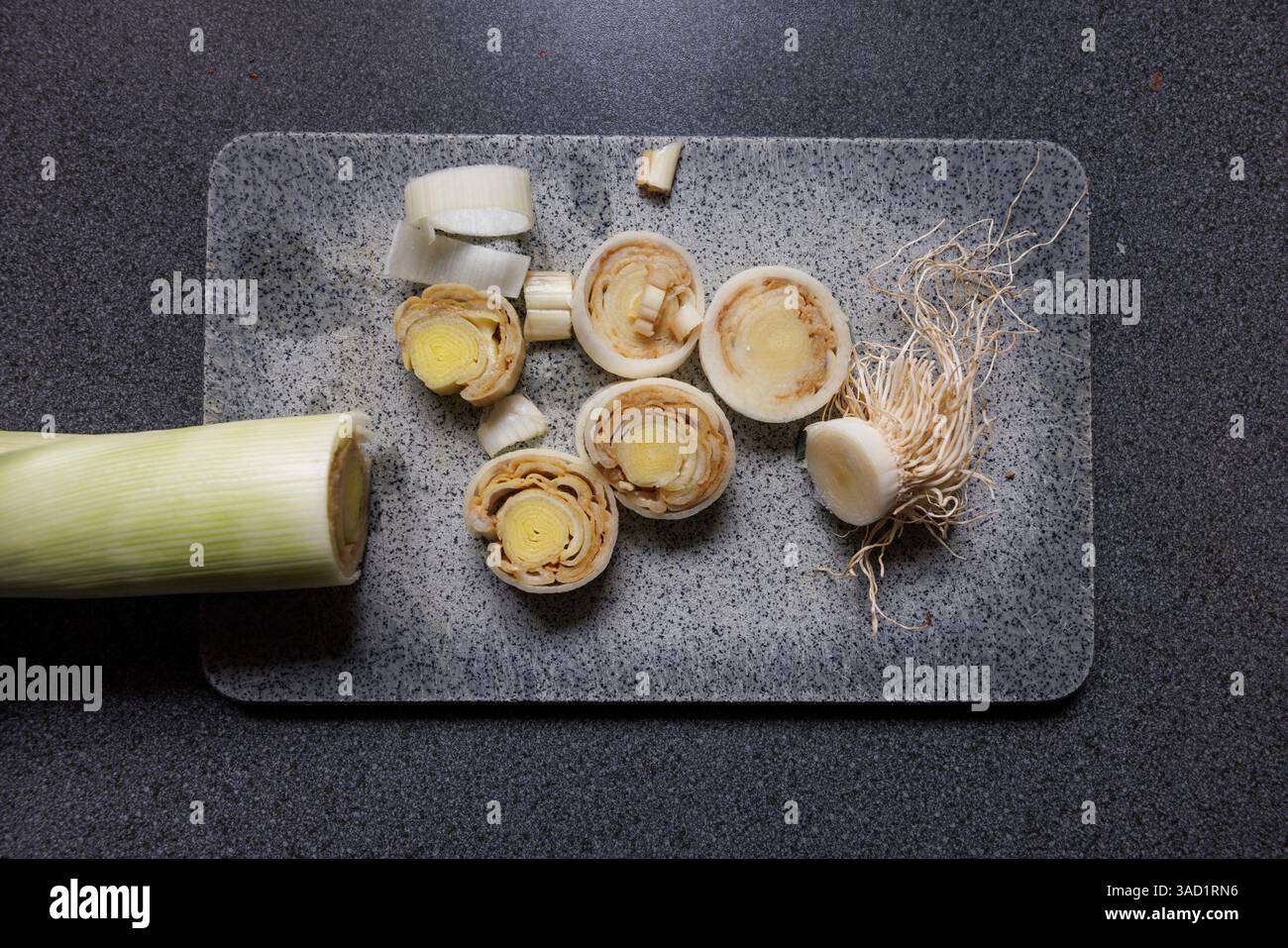 Sliced leek with rot damage on cutting board Stock Photo - Alamy