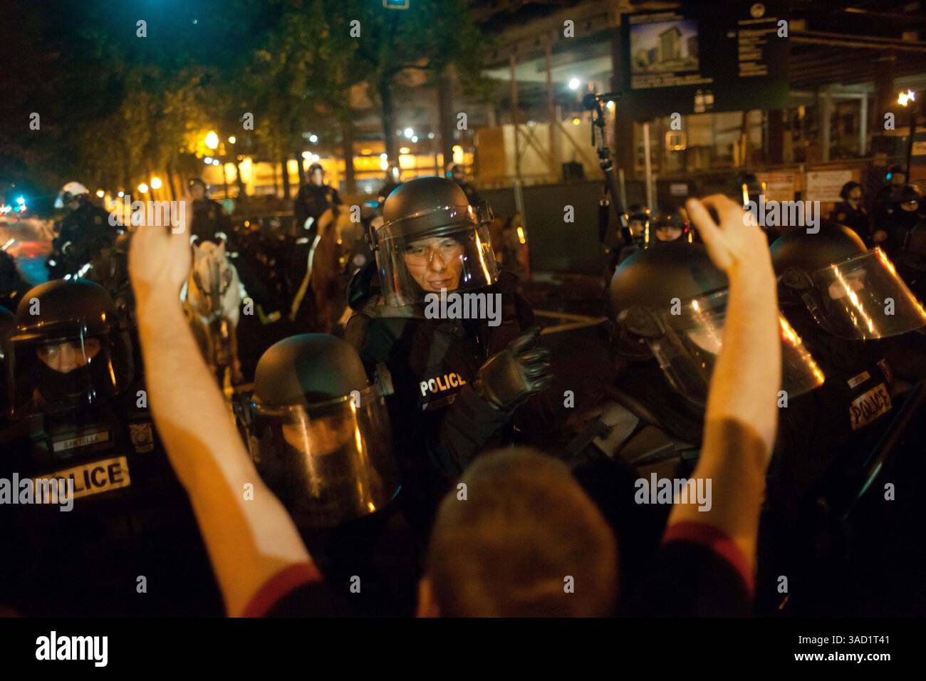 Police protestor hug hi-res stock photography and images - Alamy