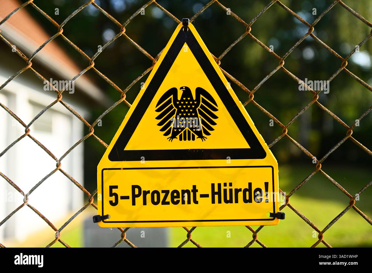 Warning sign with inscription 5 percent hurdle and federal eagle ...