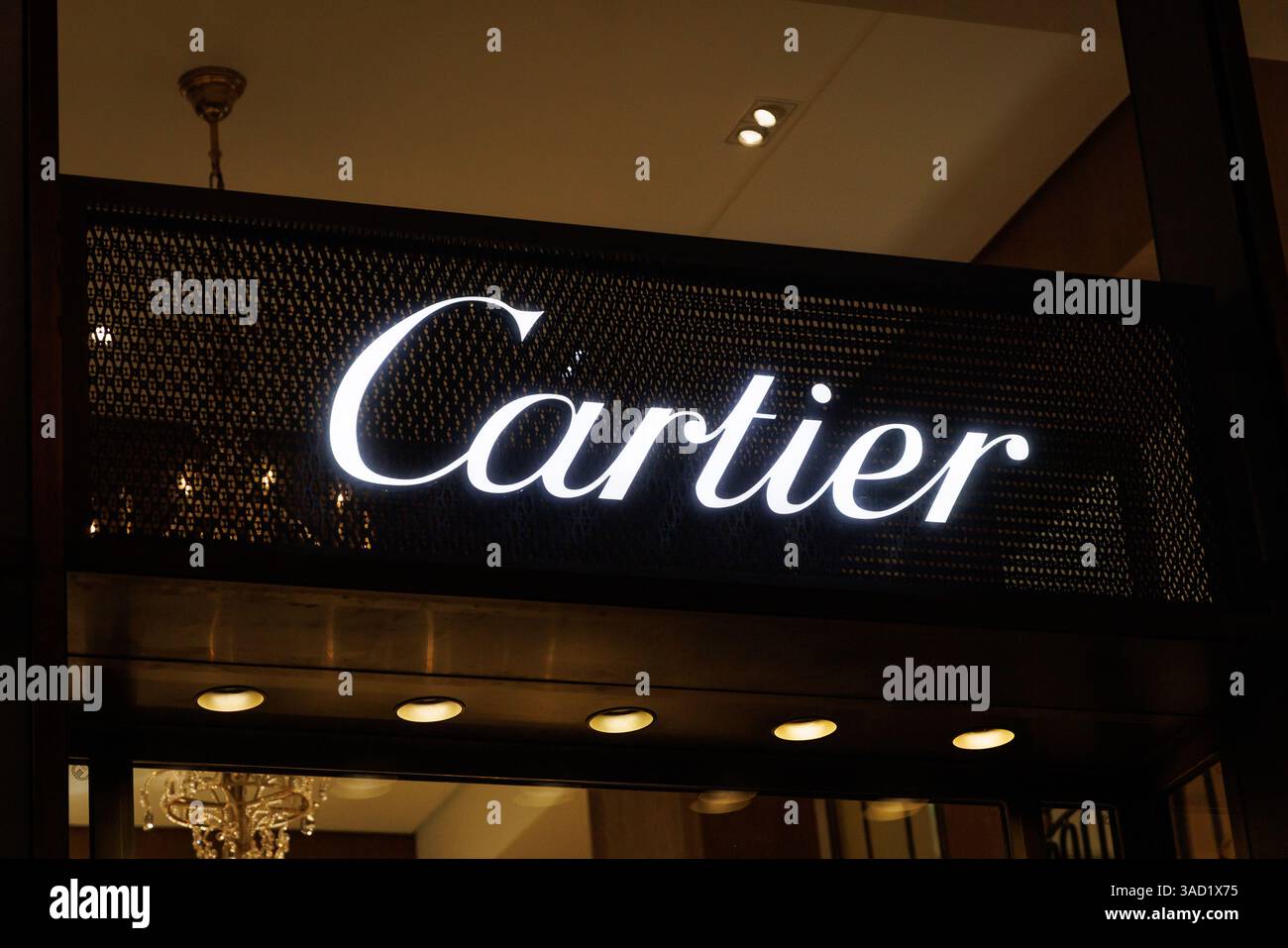 PARIS, FRANCE - 18 February 2025: A large sign "Cartier" in white ...