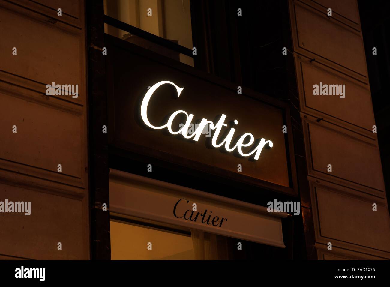 PARIS, FRANCE - 18 February 2025: A large sign "Cartier" in white ...