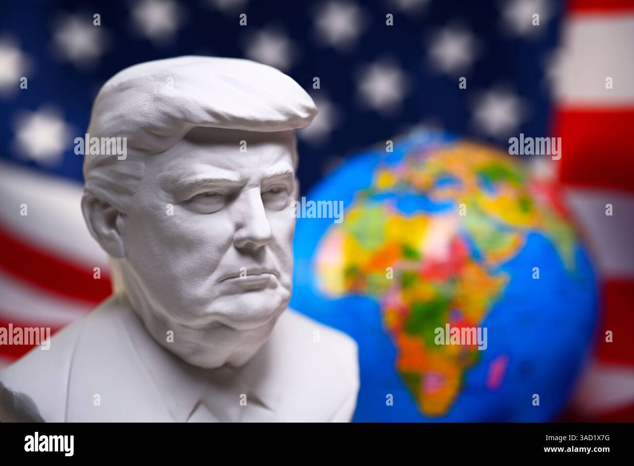 Bust of Donald Trump in front of US flag and globe Stock Photo - Alamy