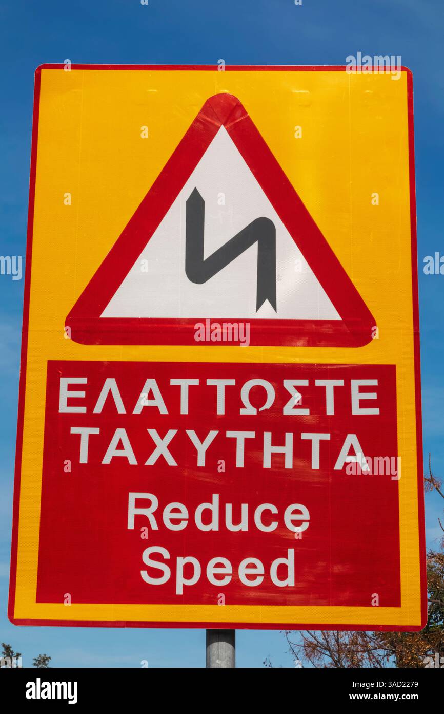 Reduce speed dual language road sign hi-res stock photography and ...