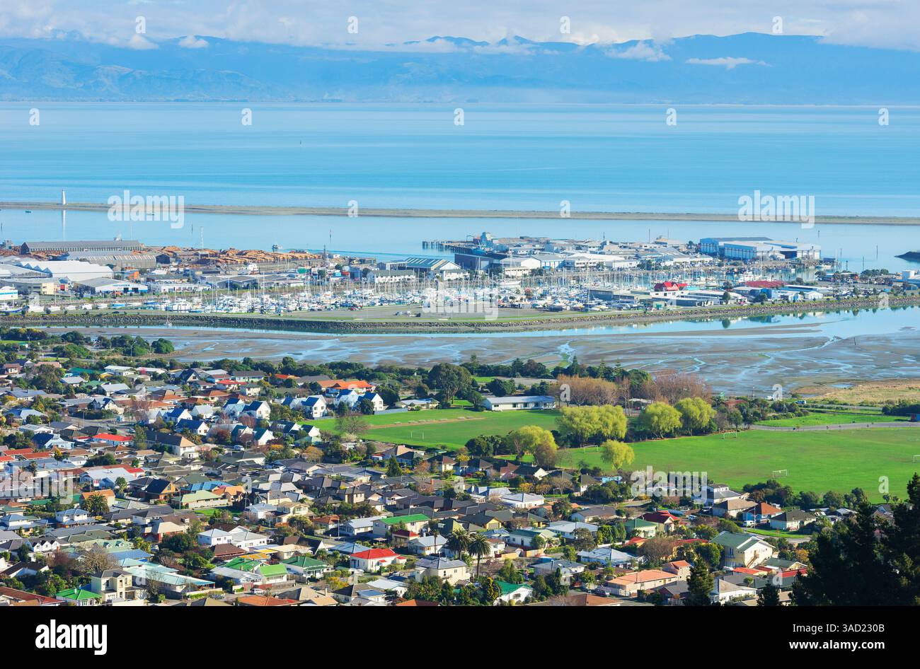 View of Nelson town and Mount Arthur mountain range in the distance ...