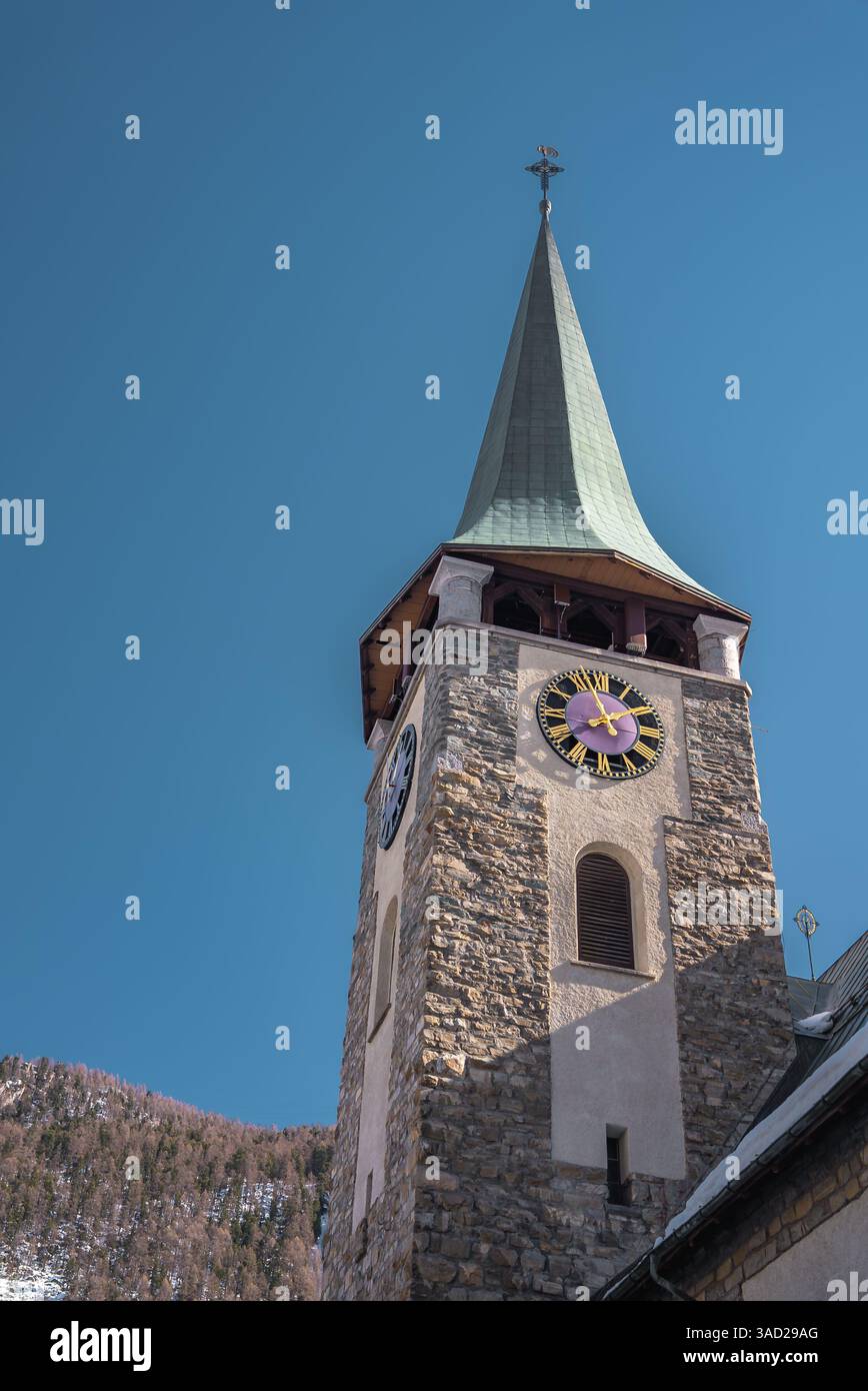 St. Mauritius Church Clock Tower with Snow Dusted Trees in Zermatt ...