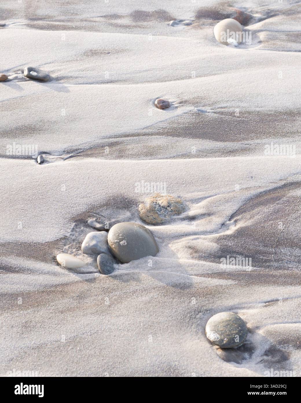 Round pebbles in the beach sand, view from above Stock Photo - Alamy