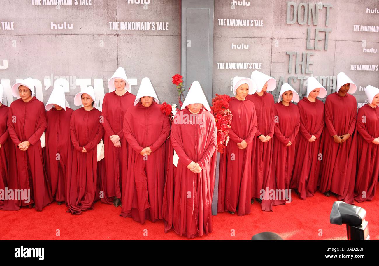 HOLLYWOOD, CALIFORNIA - APRIL 02: Cosplayers dressed as handmaids from ...