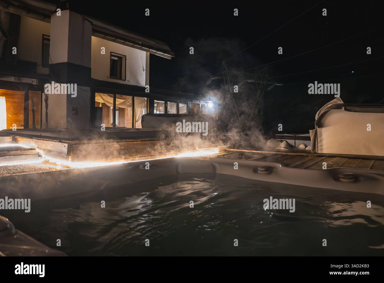 Luxurious Alpine Hotel with Outdoor Hot Tub at Night in Zermatt Stock ...