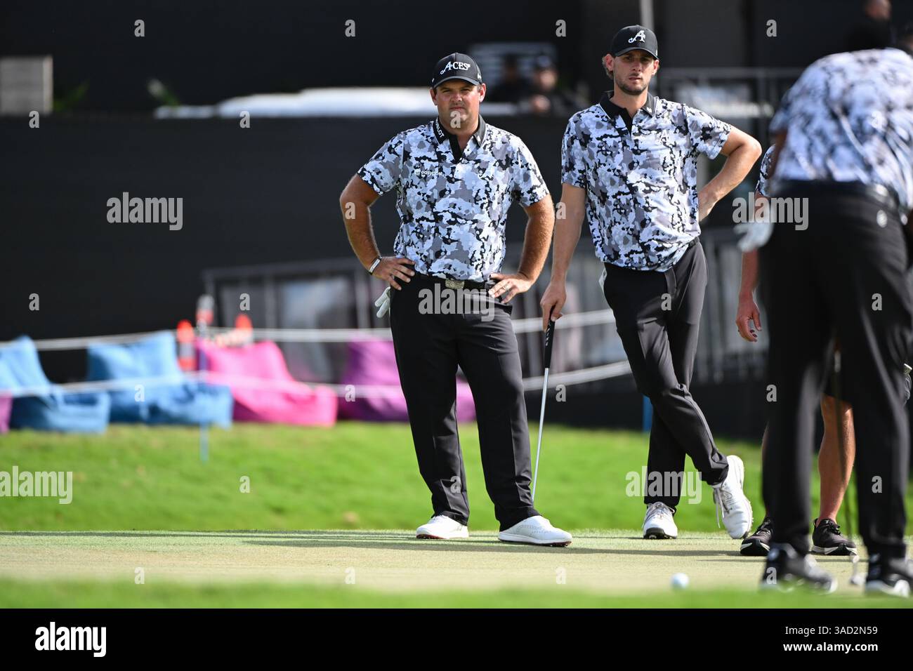 Patrick Reed of the 4Aces GC watches Harold Varner III of the 4Aces GC ...