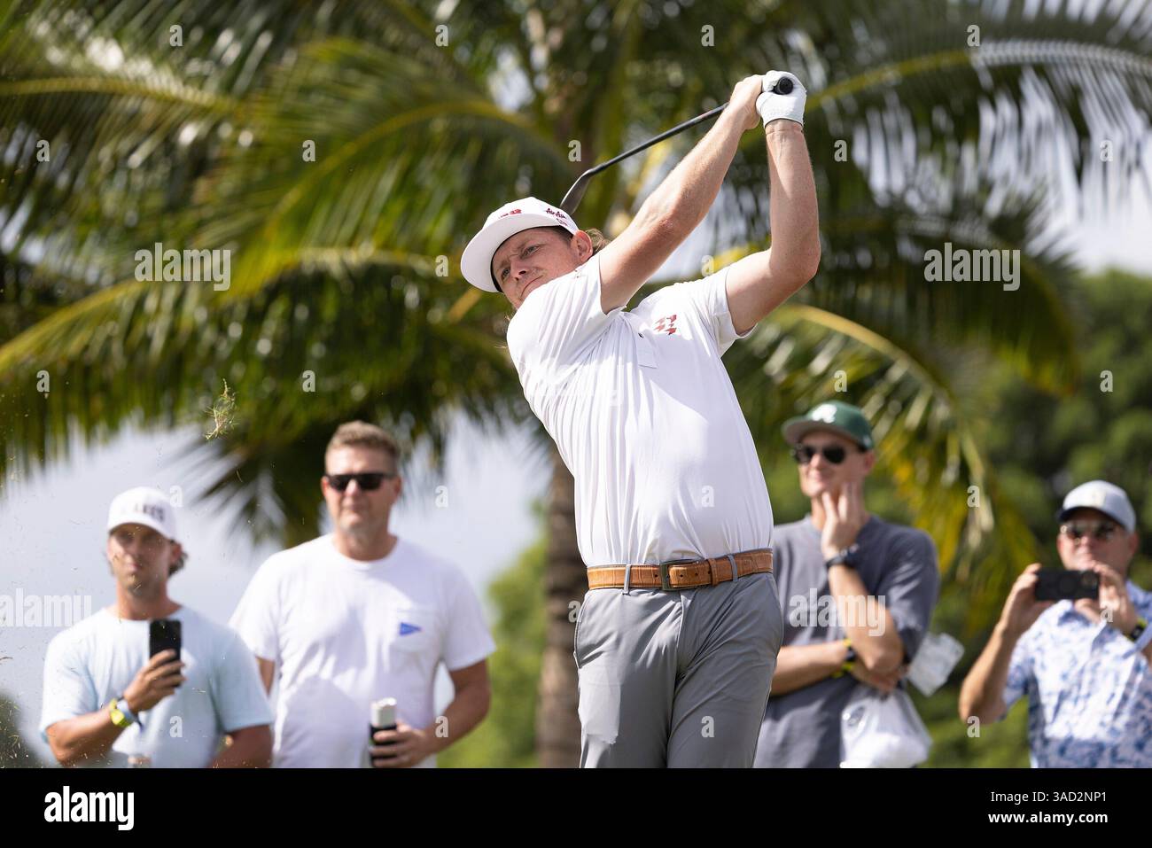 Captain Cameron Smith of Ripper GC hits his shot on the 17th hole ...