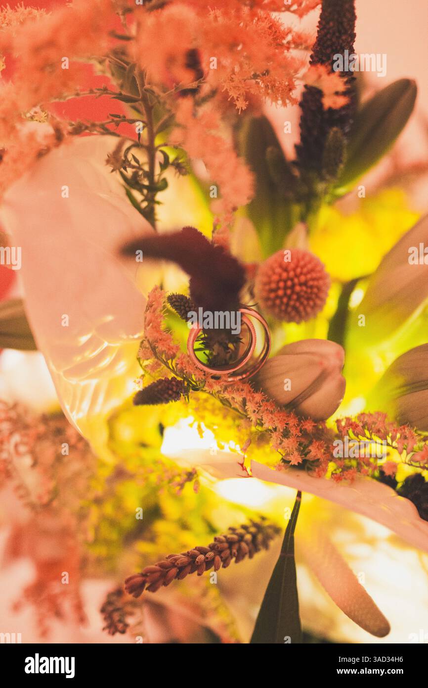 Rings in bridal bouquet with indirect lighting hi-res stock photography ...