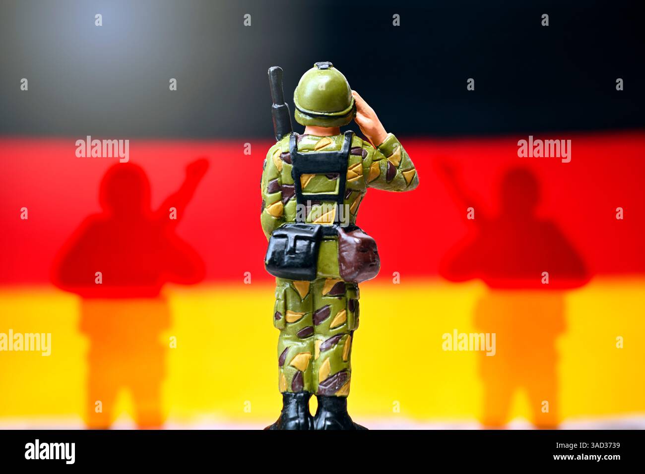 Soldier in front of a German flag, symbolic photo of compulsory ...