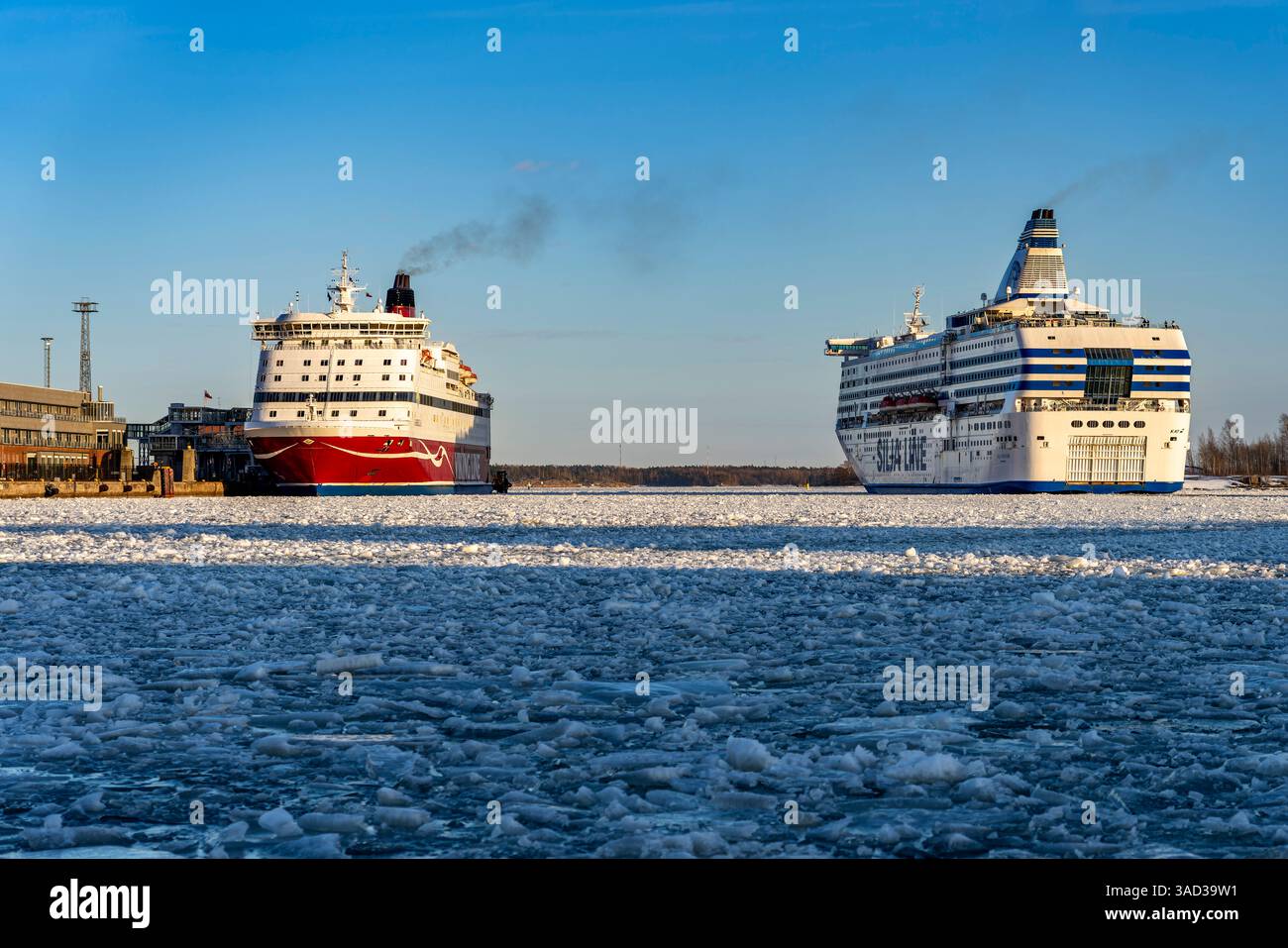 Helsinki, ships in the south harbor surrounded by ice floes, the ships ...
