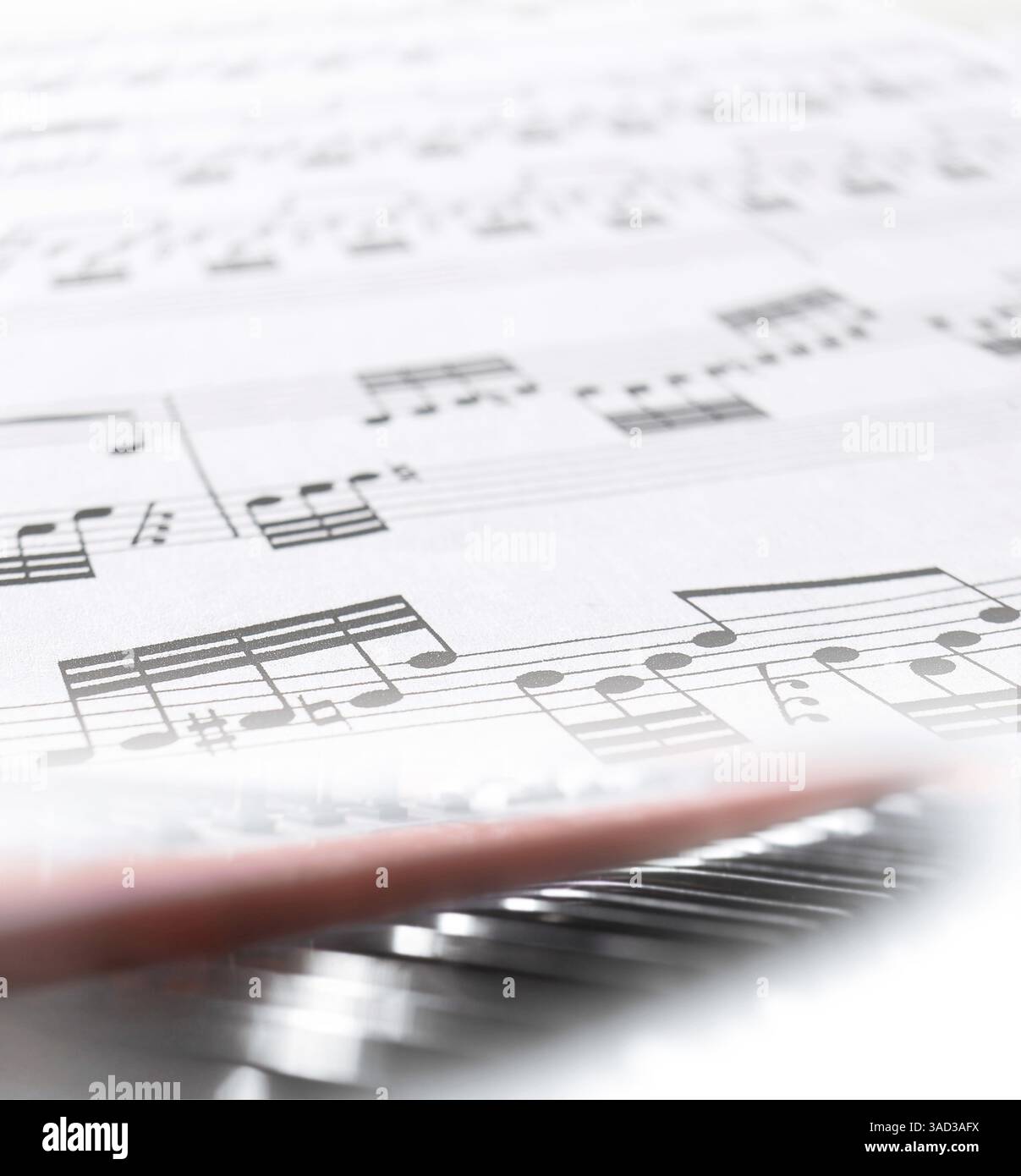 Piano keys, sheet music, composing Stock Photo - Alamy