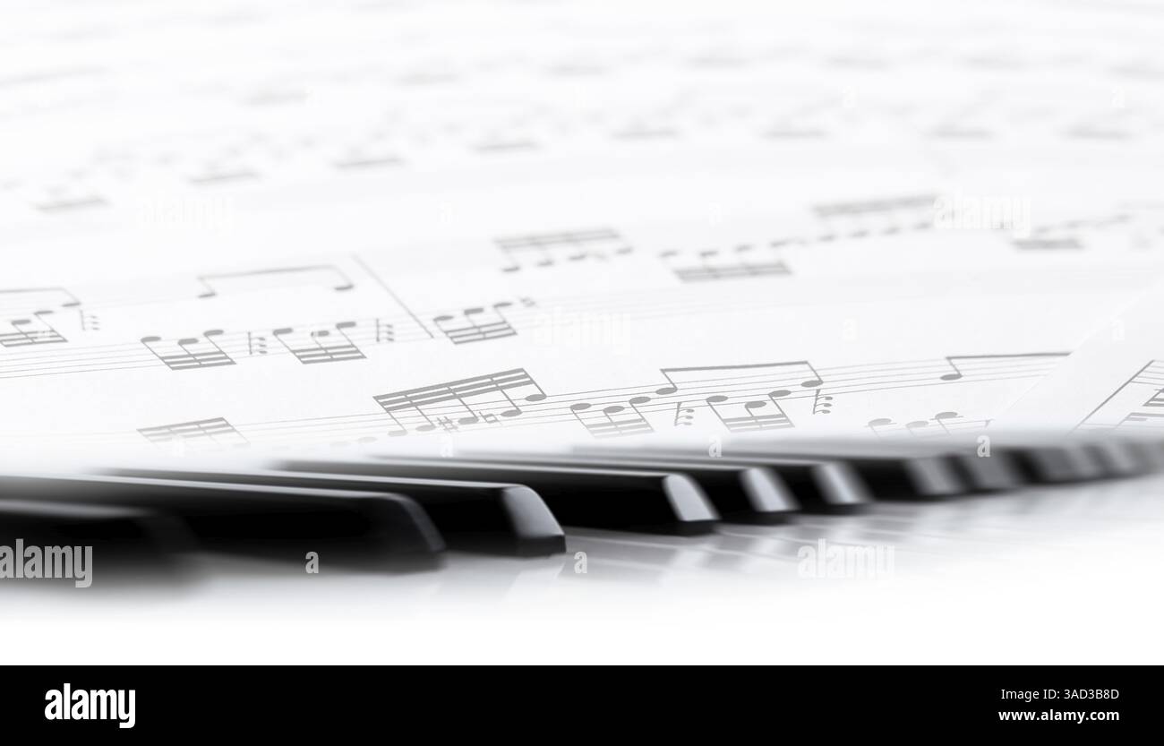 Piano keys, sheet music, composing Stock Photo - Alamy