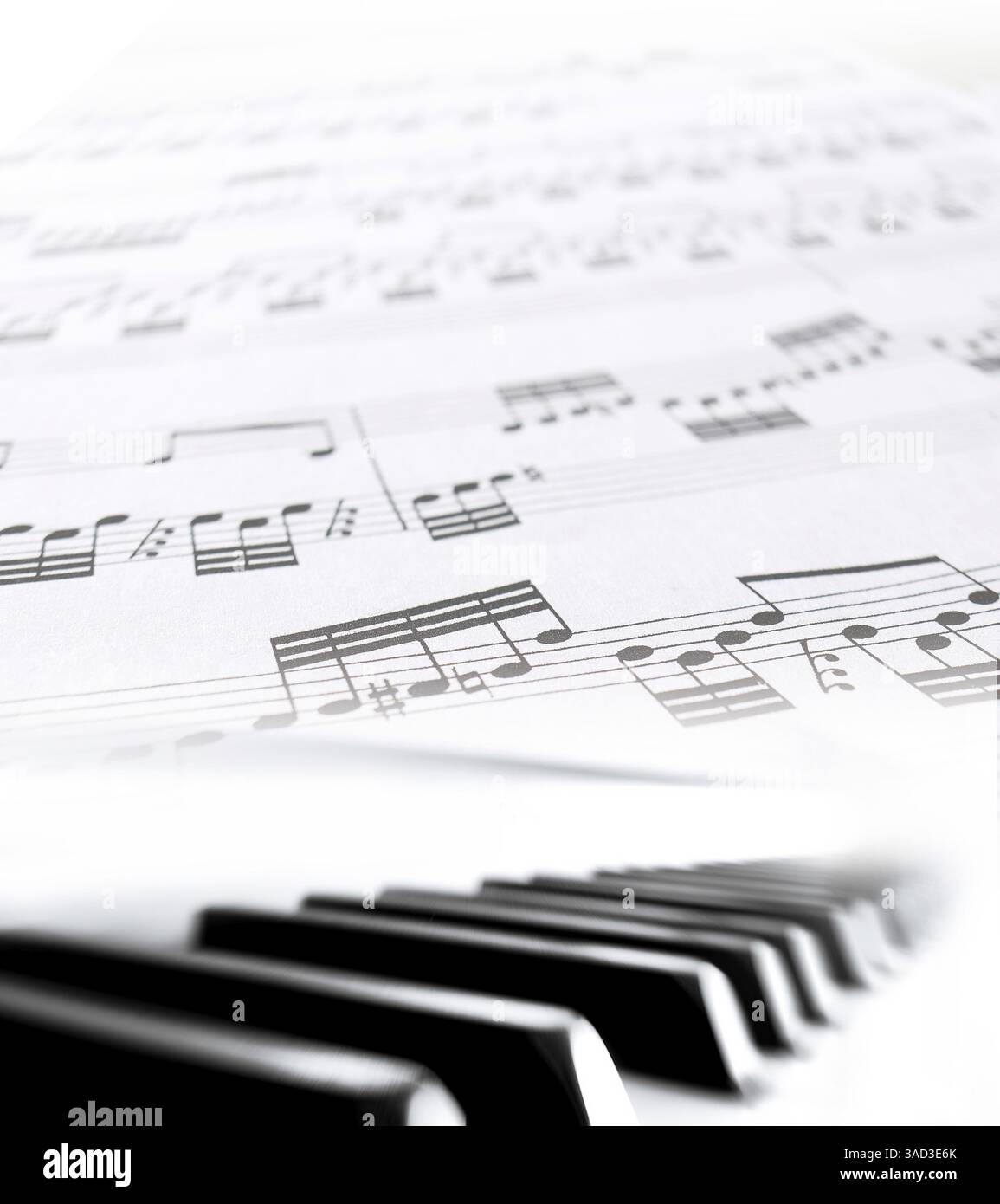 Piano keys, sheet music, composing Stock Photo - Alamy