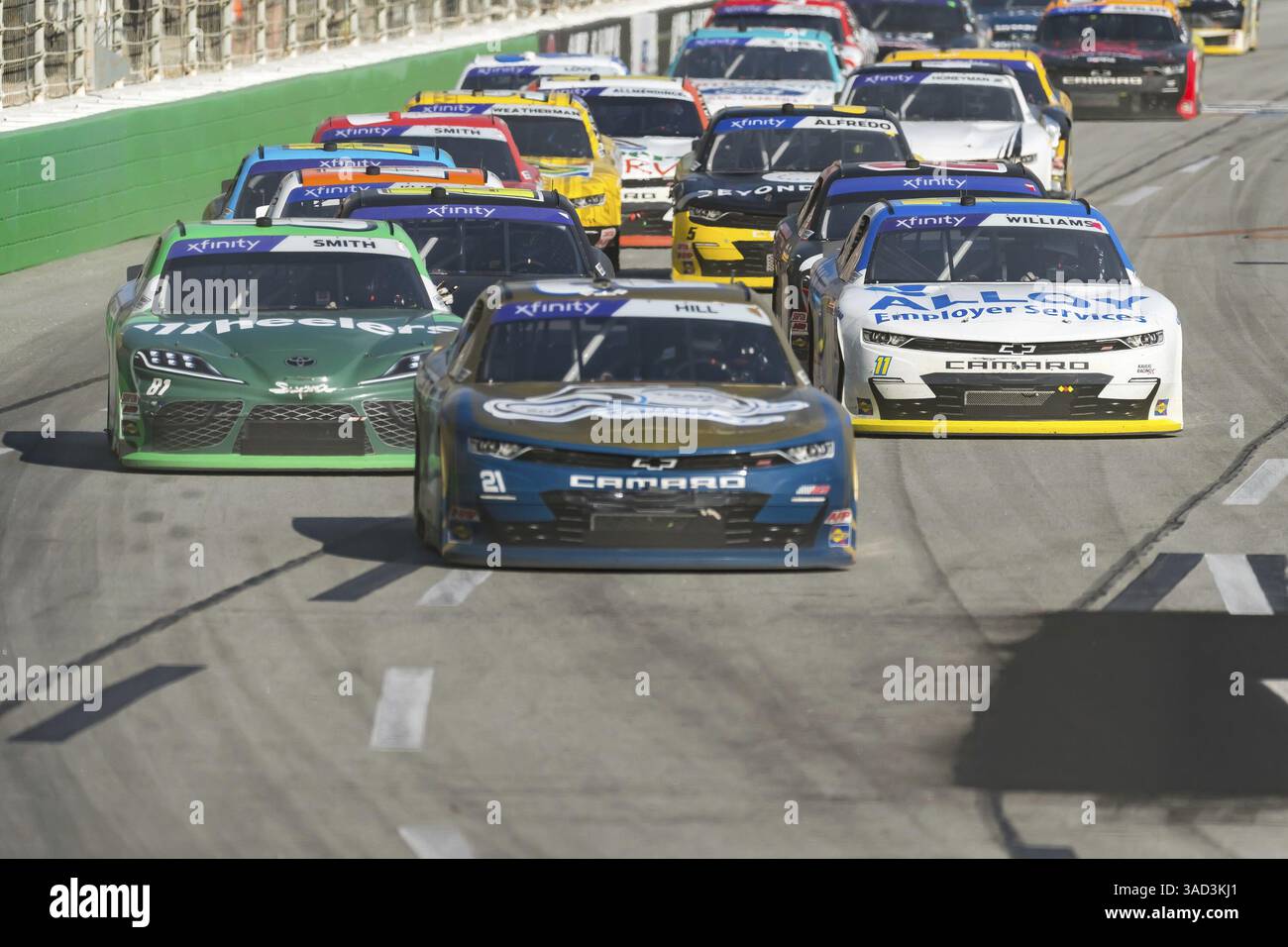 NASCAR Xfinity Series driver, AUSTIN HILL (21) races through the turns ...