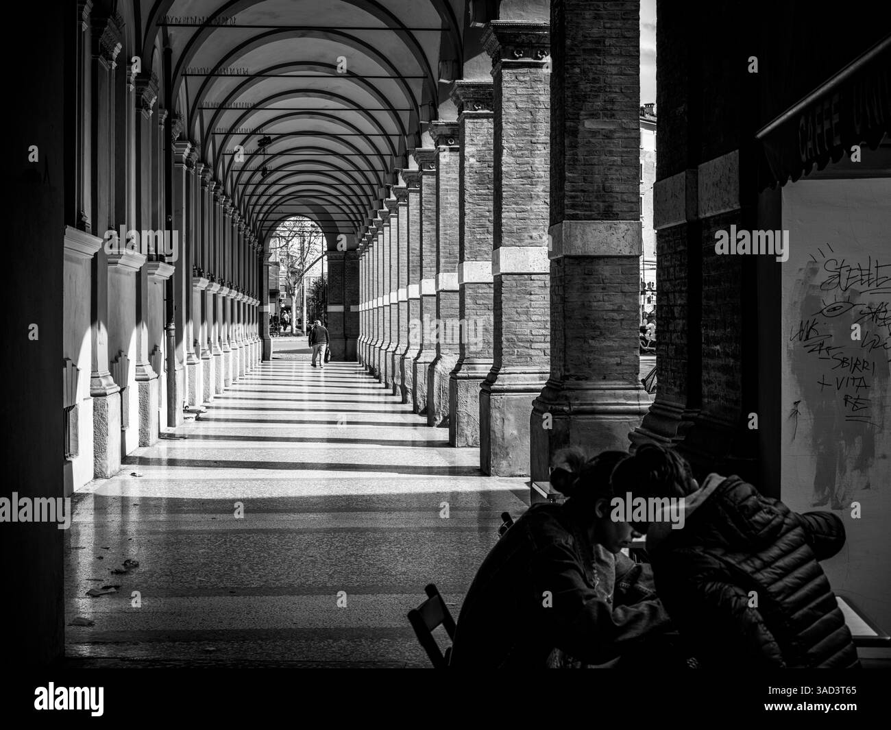 Italy, Bologna, Arcades in Via Zamboni, black and white Stock Photo - Alamy