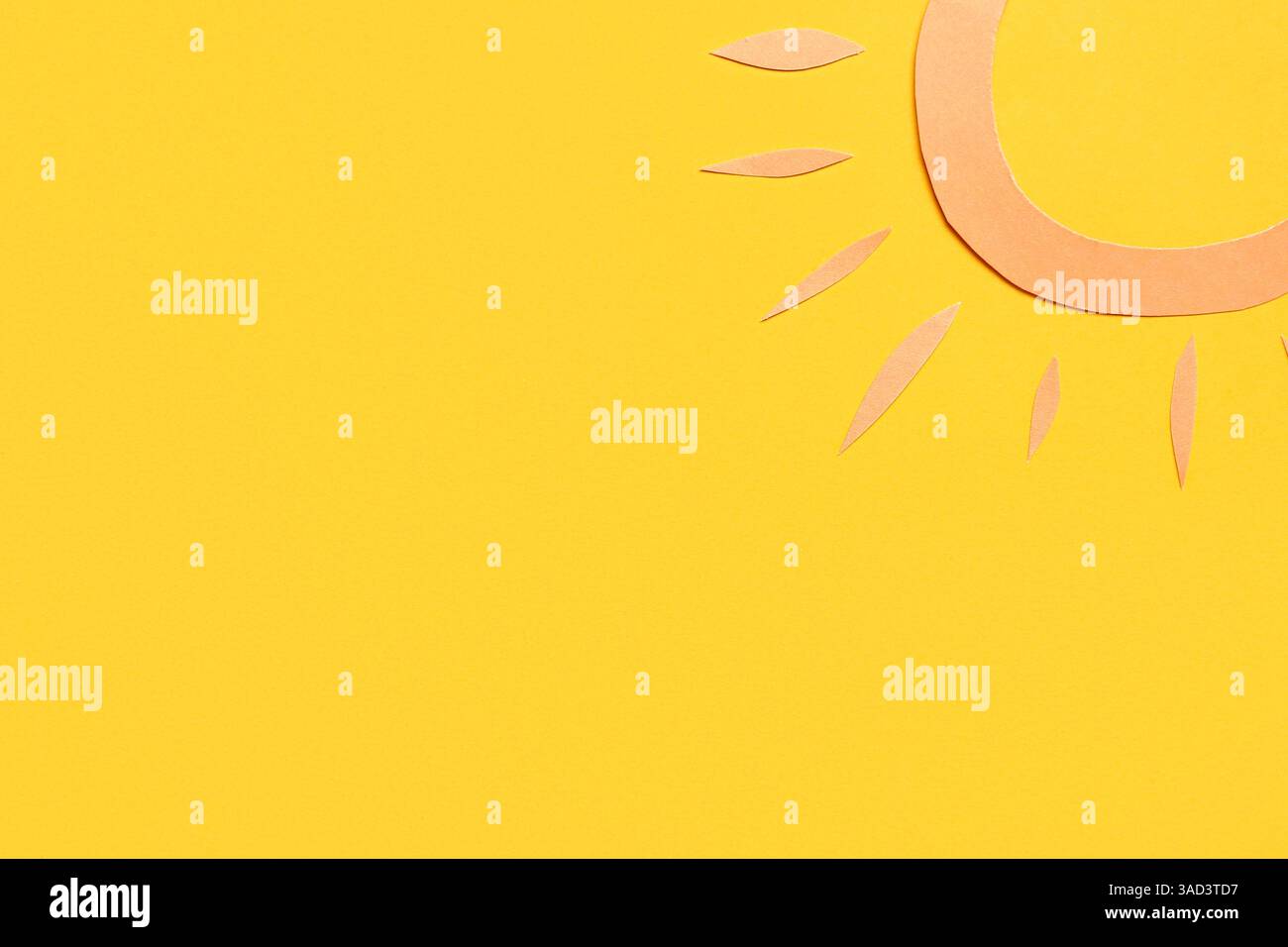 Paper sun on yellow background Stock Photo - Alamy