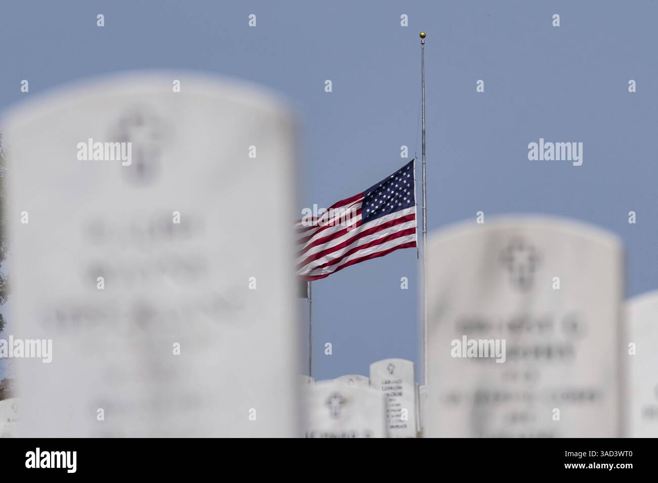 Generic views of a veterans cemetery on a serene day, featuring ...