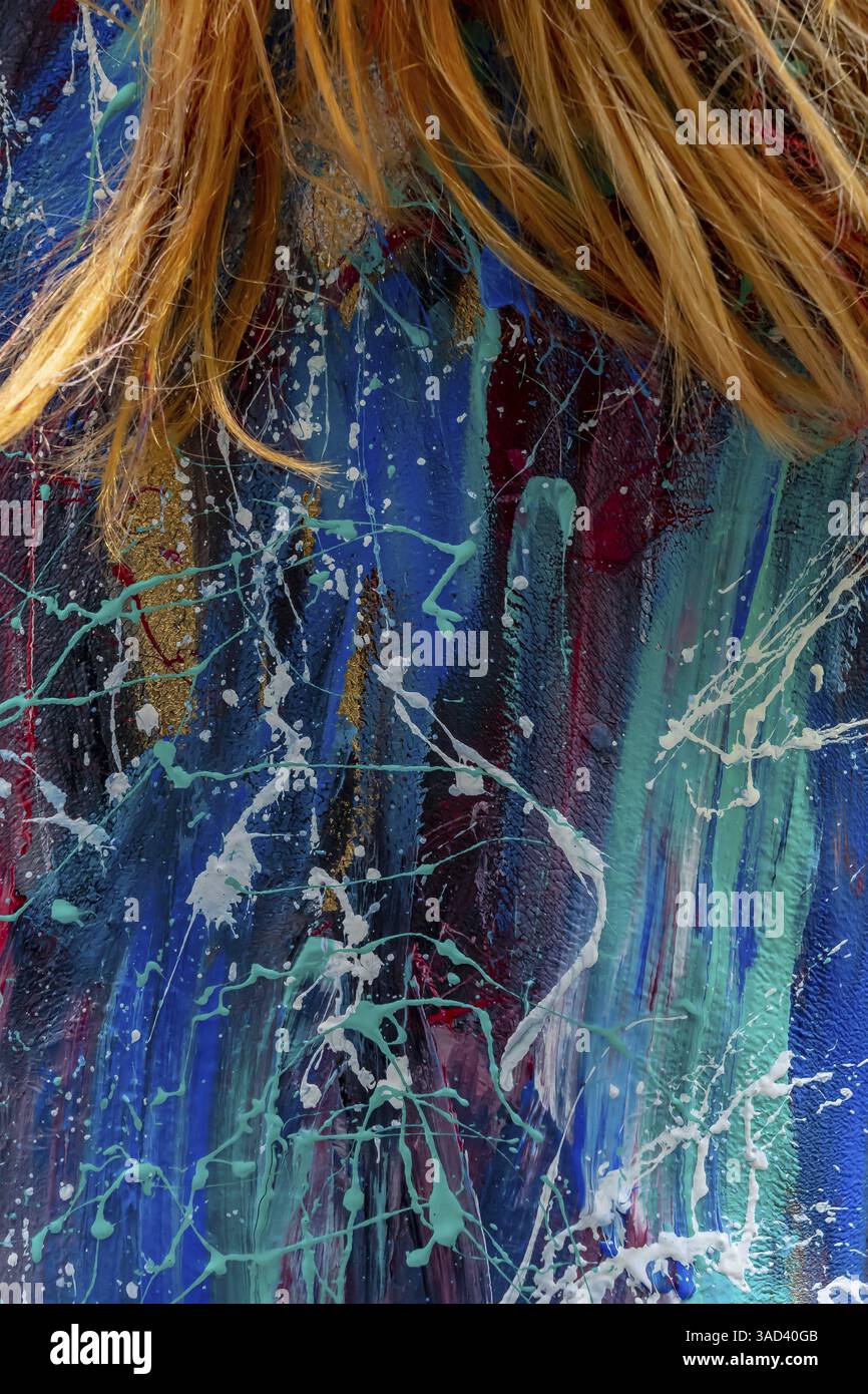 A model poses gracefully, her body adorned in vibrant body paint, with ...