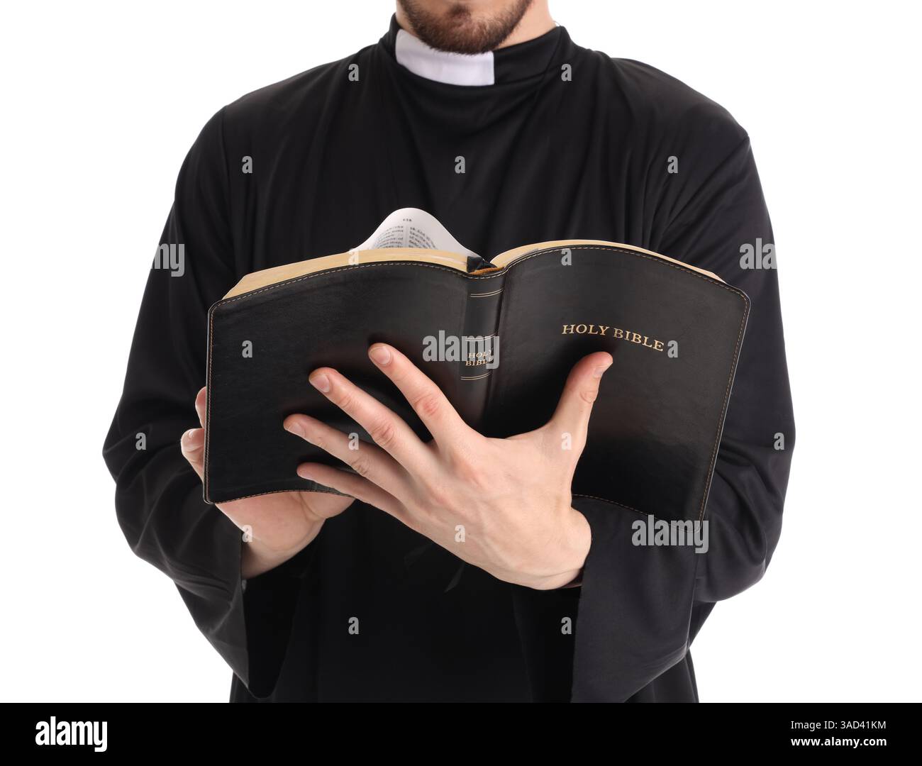 Young priest reading Holy Bible on white background, closeup Stock ...