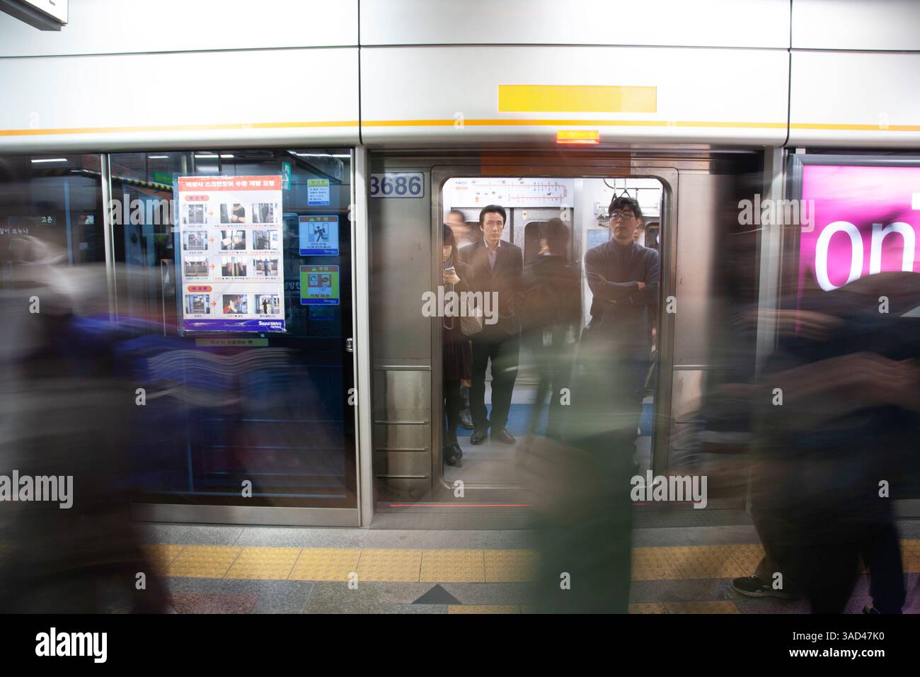 SEOUL, SOUTH KOREA. 20 APRIL, 2011. Passengers exit a crowded Seoul ...