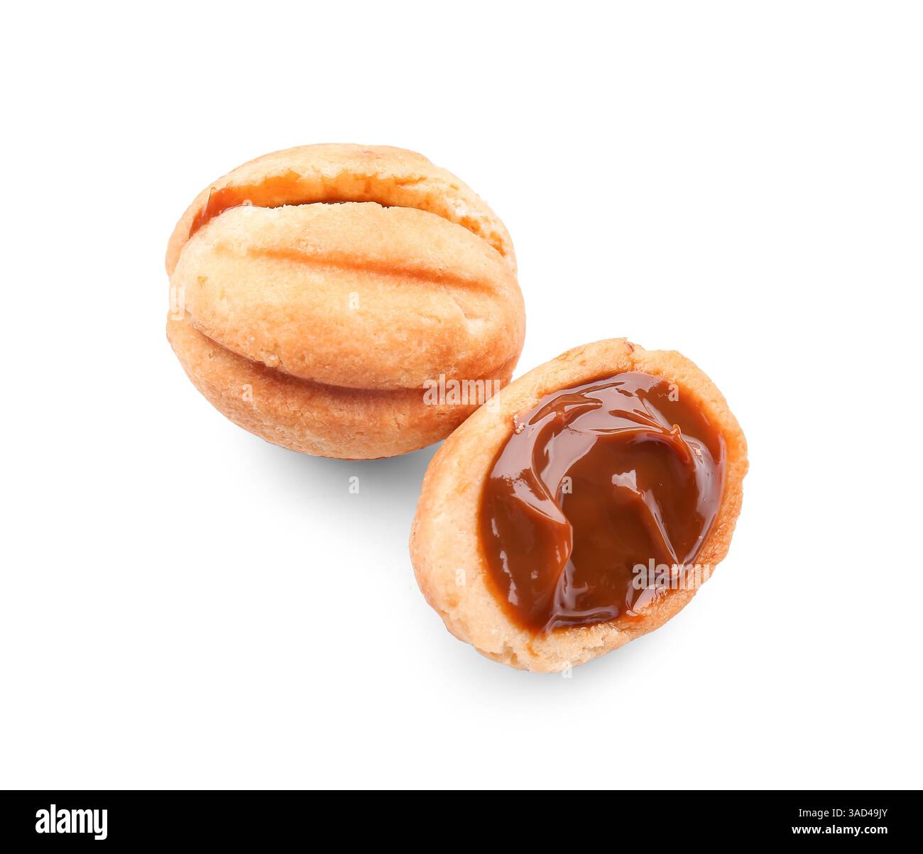 Sweet walnut shaped cookies with boiled condensed milk on white ...