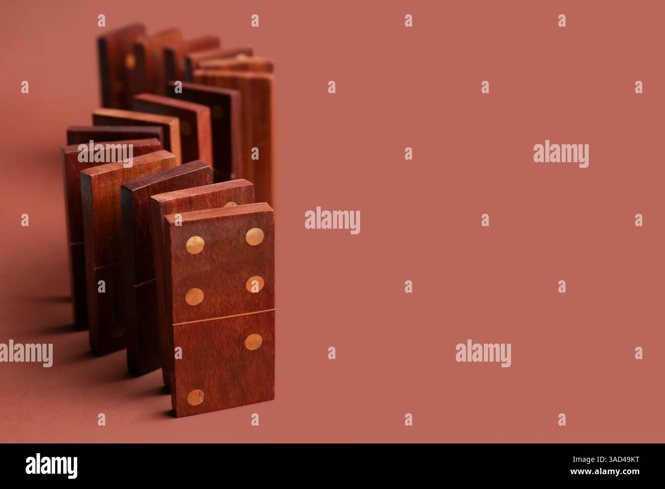 Many wooden dominos blocks on brown background Stock Photo - Alamy