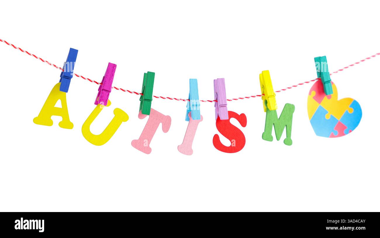 Word AUTISM hanging on rope against white background Stock Photo - Alamy