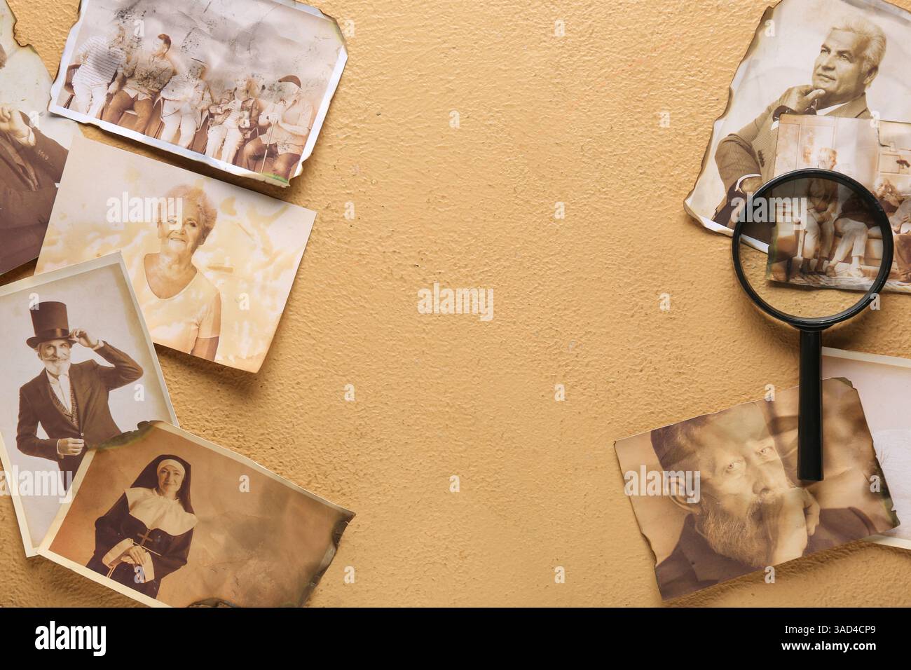 Old photos of relatives and magnifier on beige background. Concept of ...