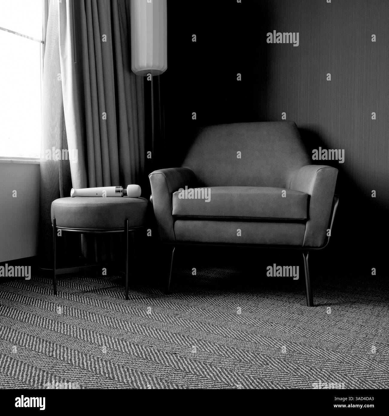 Cordless Wand Vibrator Resting On A Cushioned Table Next To A Chair In A Hotel Room By A Window