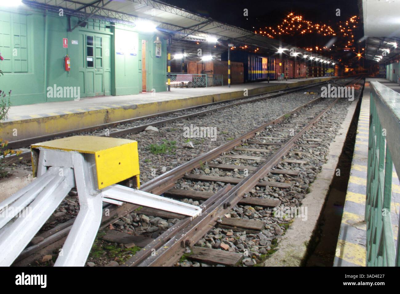 Tracks of the train station alone at night in Cusco Peru Stock Photo ...