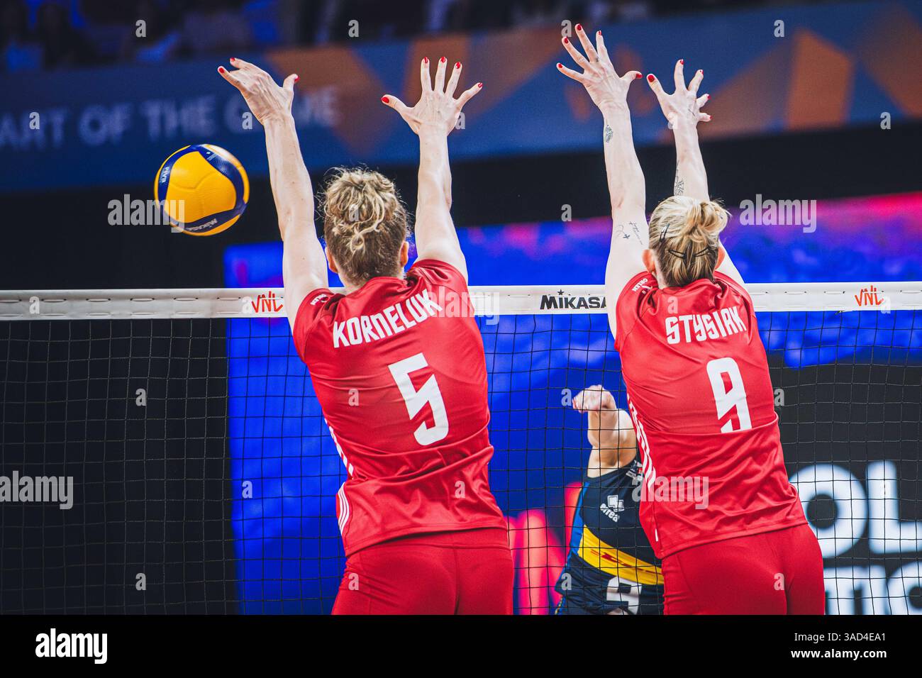 Volleyball players from Poland and the Italy in action during the FIVB Women Volleyball Nations ...