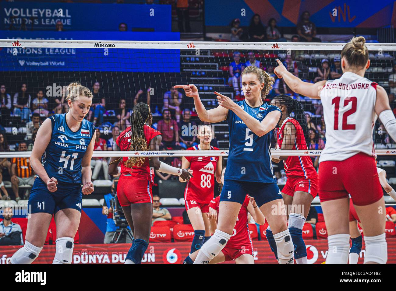 Volleyball players from France and the Poland in action during the FIVB ...