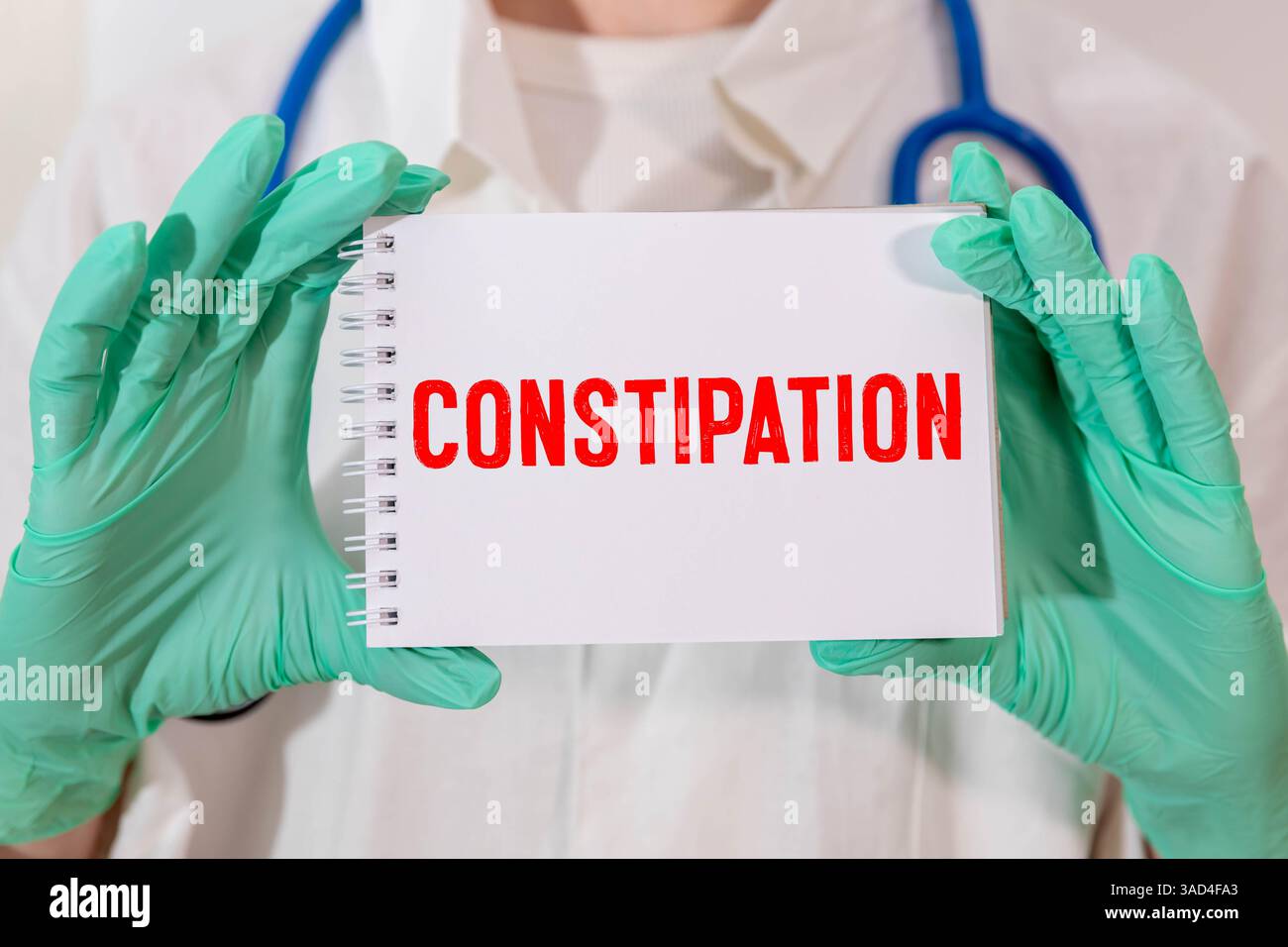 Toilet paper with text constipation in wc. Concept of personal hygiene ...