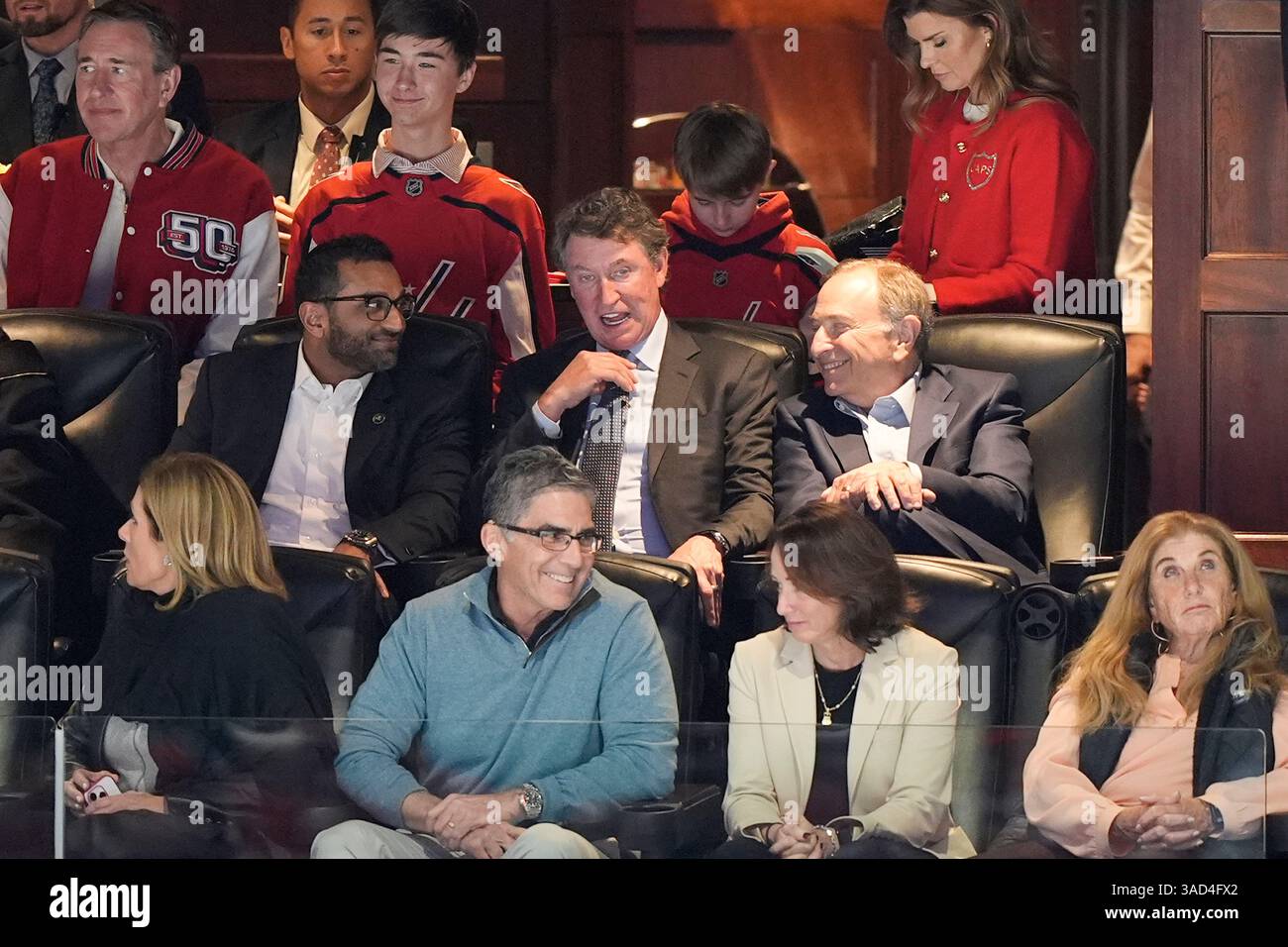 FBI director is Kash Patel, left, tallking with former NHL player Wayne ...