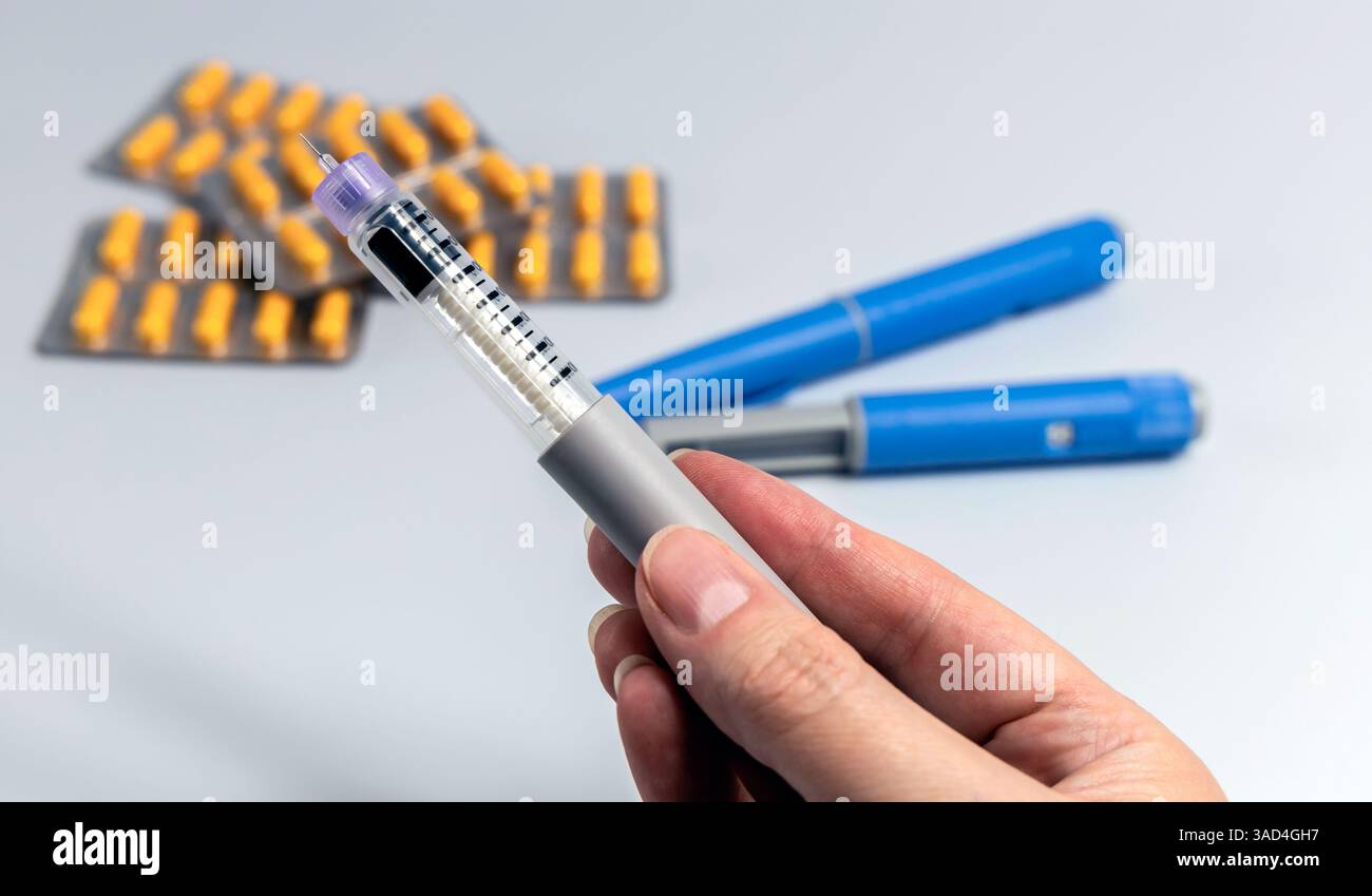 Hand holding Ozempic Insulin injection pen for diabetics and weight ...