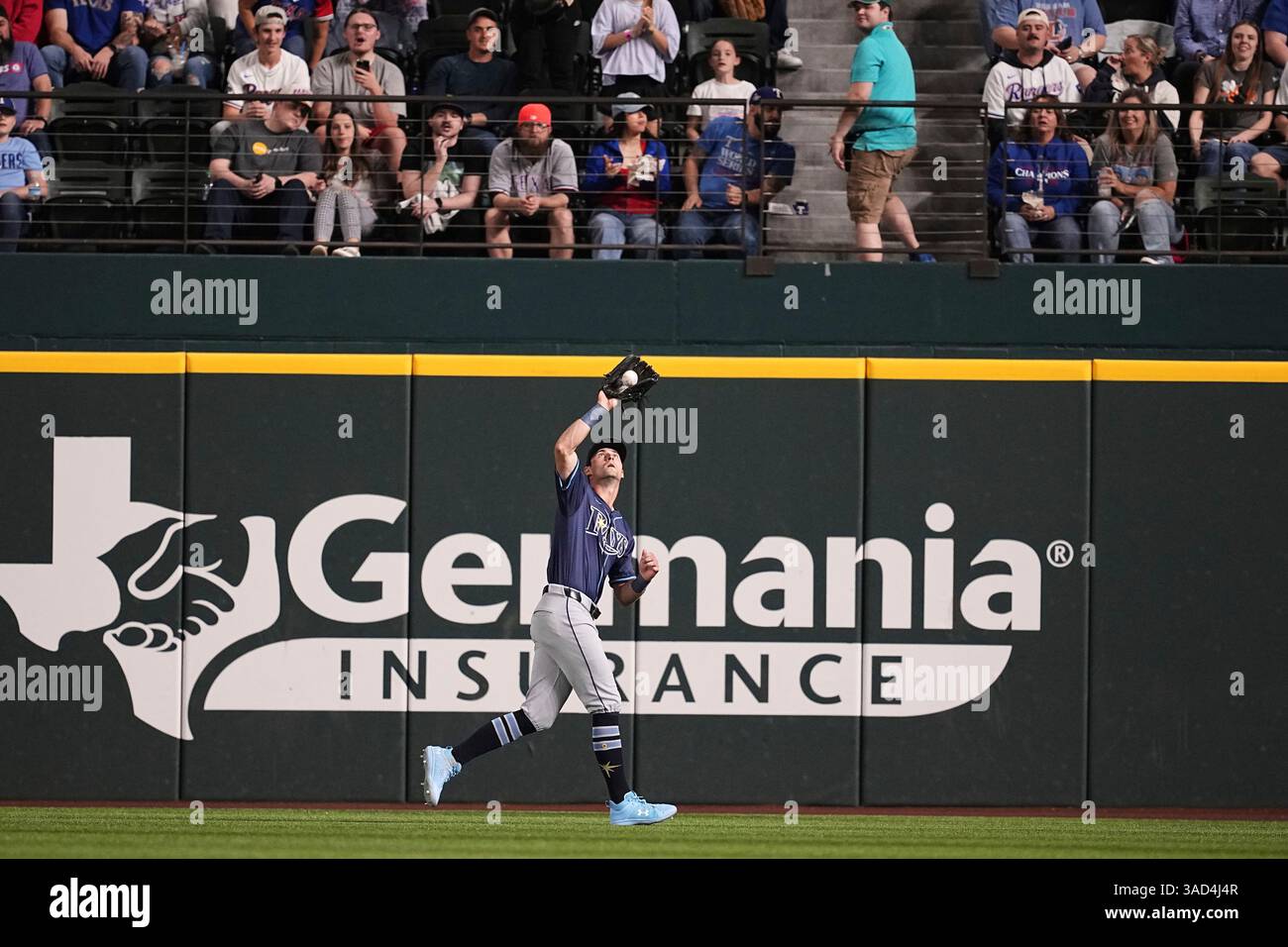 Tampa Bay Rays right fielder Kameron Misner reaches up to catch a ...