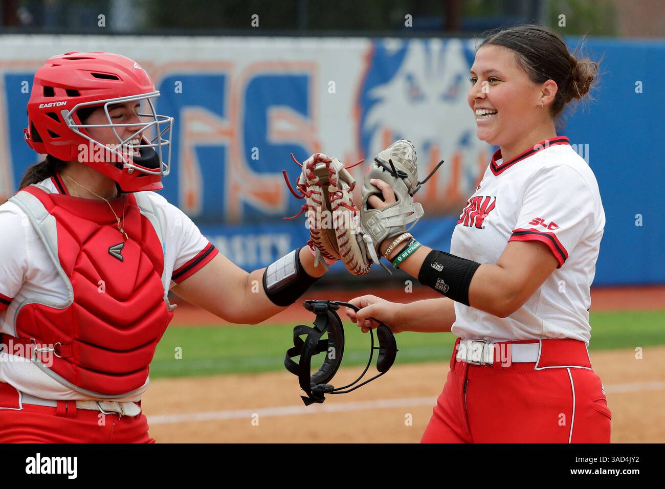 Incarnate Word catcher Erin Perez, left, and pitcher Bella Mitchell ...