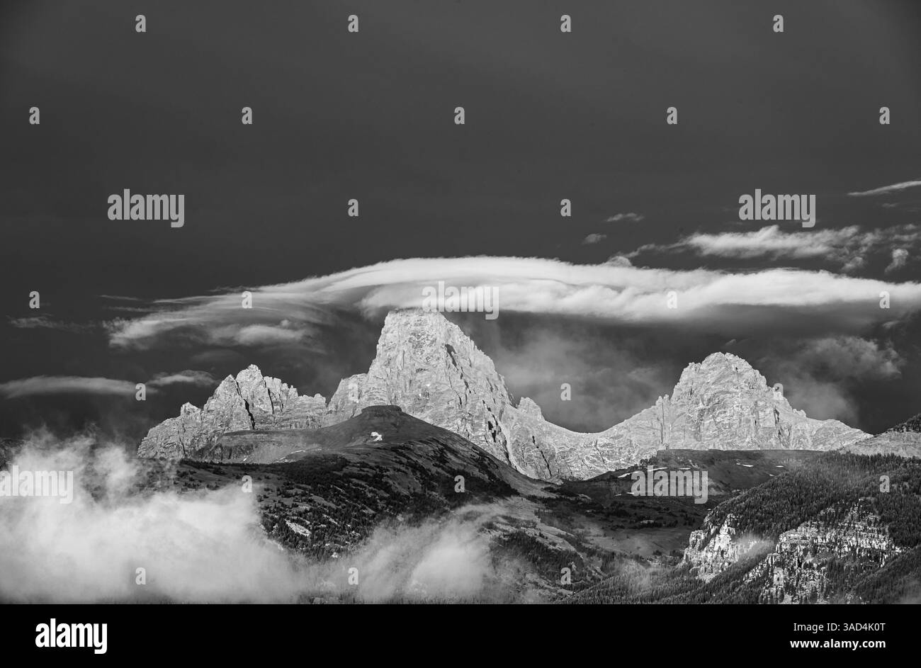 USA, Wyoming. Black and white of stratus clouds forming over Teton ...