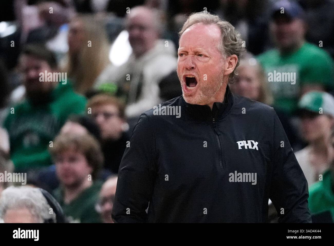 Phoenix Suns head coach Mike Budenholzer calls to his players during ...