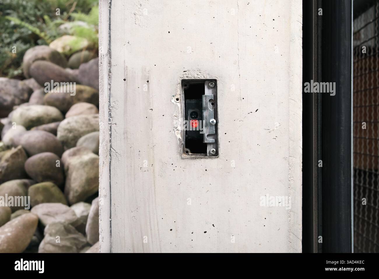 Garage gate sensor inside wall. Close up of photoelectric sensor ...