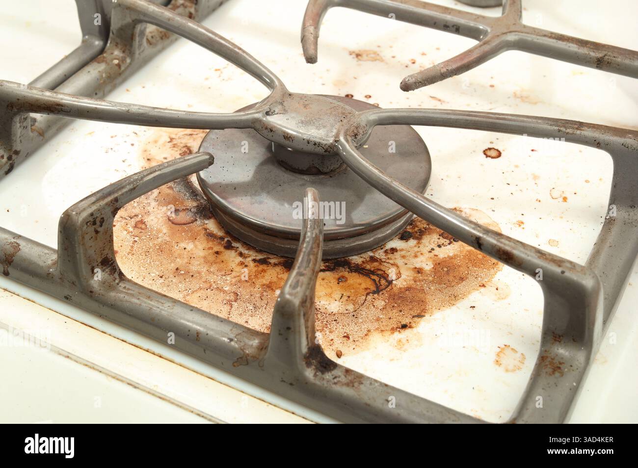 Dirty gas burner, close up. Spilled over or grease stains from cooking ...