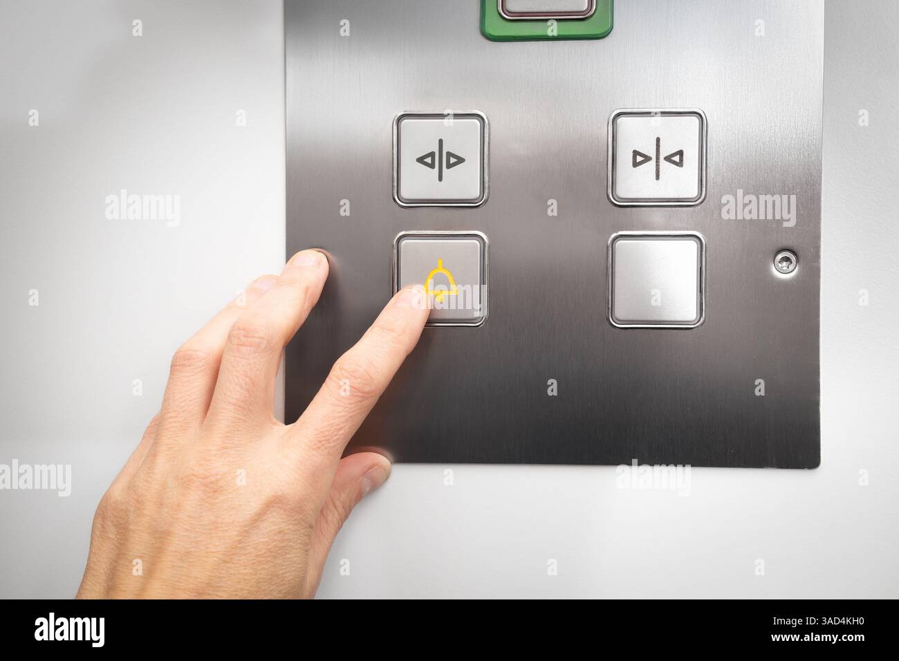 Elevator emergency call button used by passenger. Close up of woman ...