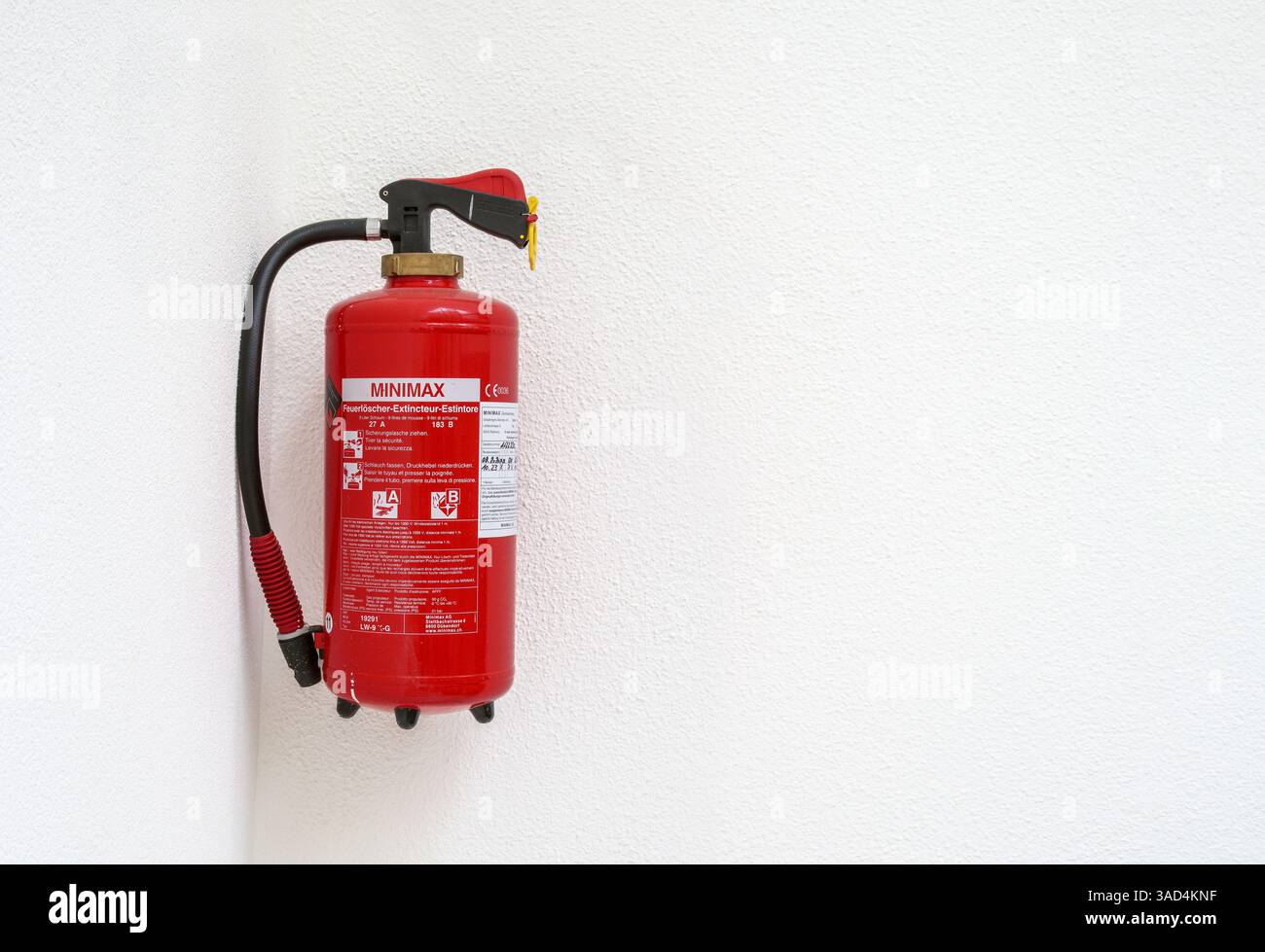 Fire extinguisher in staircase of building. Wall mounted florine-free ...