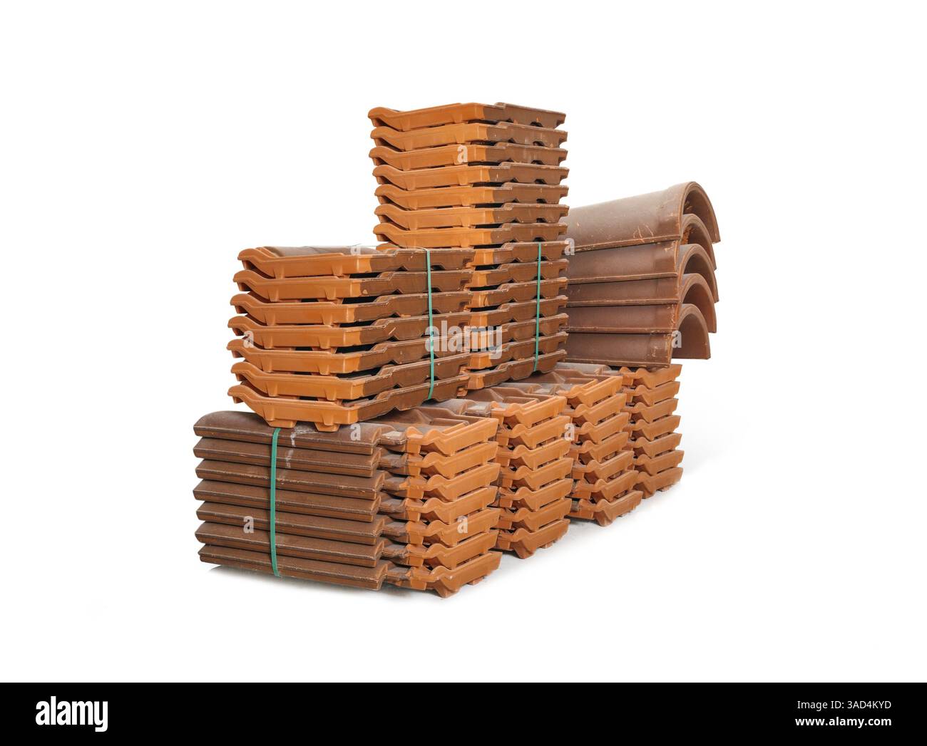 Spare clay roof tiles. Pile of orange and brown roof tiles kept for ...