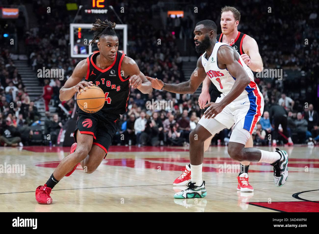 Toronto Raptors guard Ja'Kobe Walter, left, drives around Detroit ...